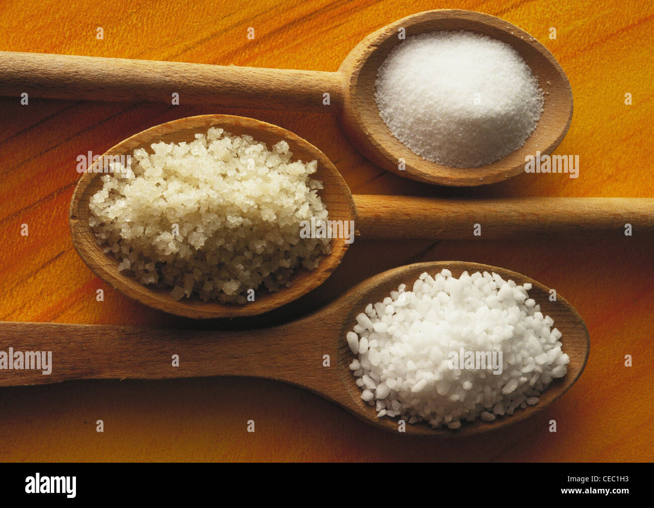 Coarse salt, sea salt and fine salt in wooden spoons, close-up Stock ...