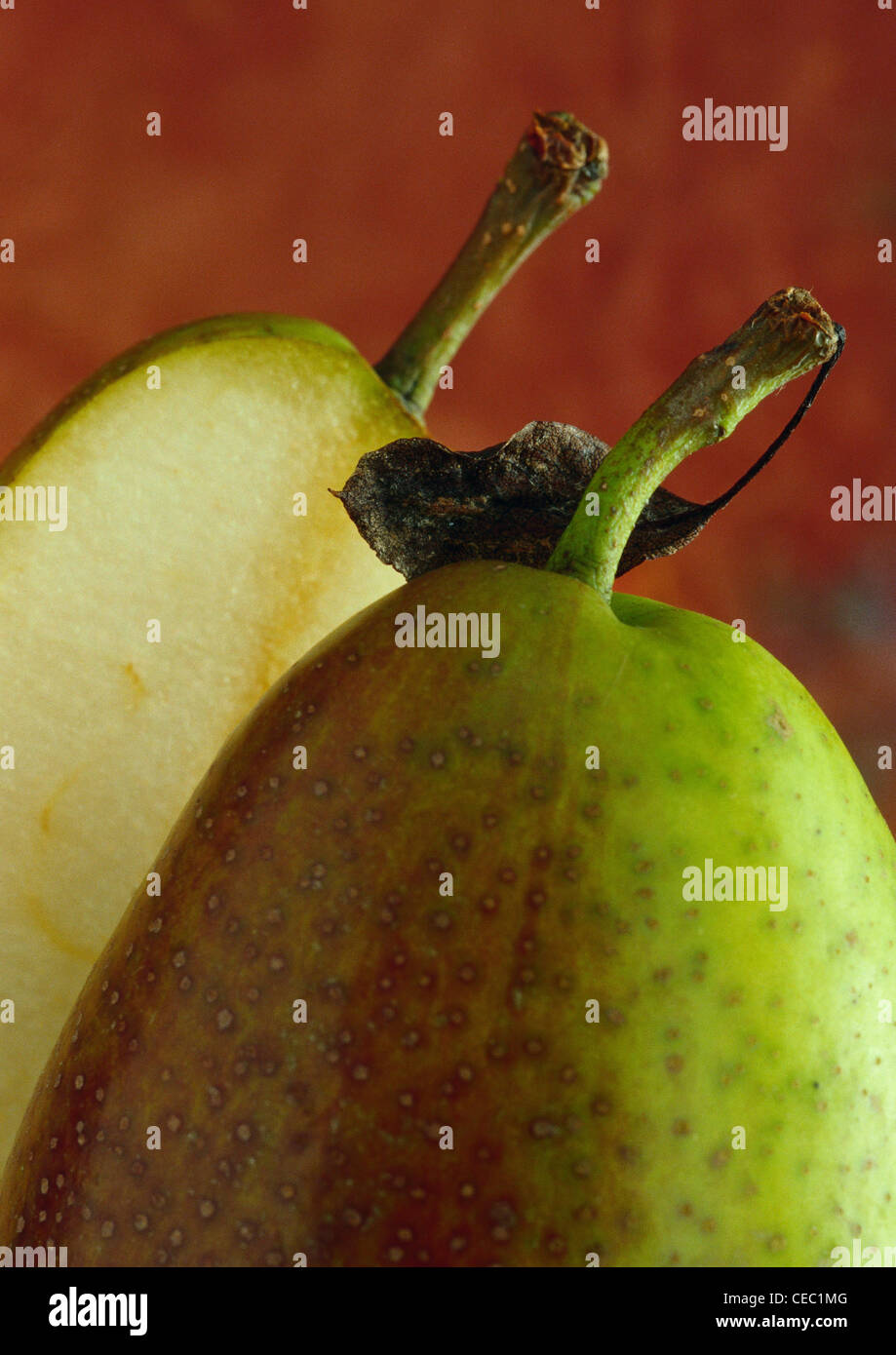 Pear cut in two, extreme close-up Stock Photo - Alamy