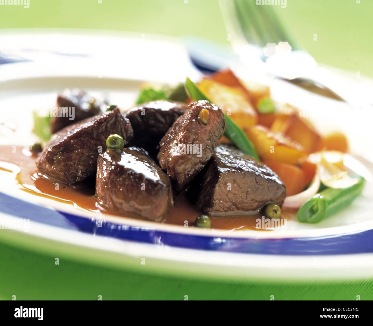 Vension ragout with green pepper sauce Stock Photo - Alamy
