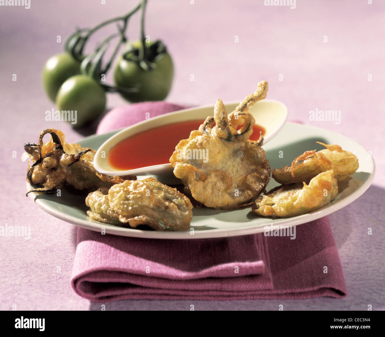 Deep fried green tomatoes in dough Stock Photo - Alamy