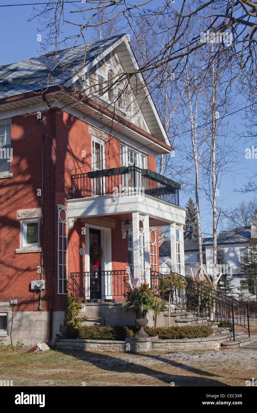 Typical Canadian brick house with wooden porch in town of Guelph ...