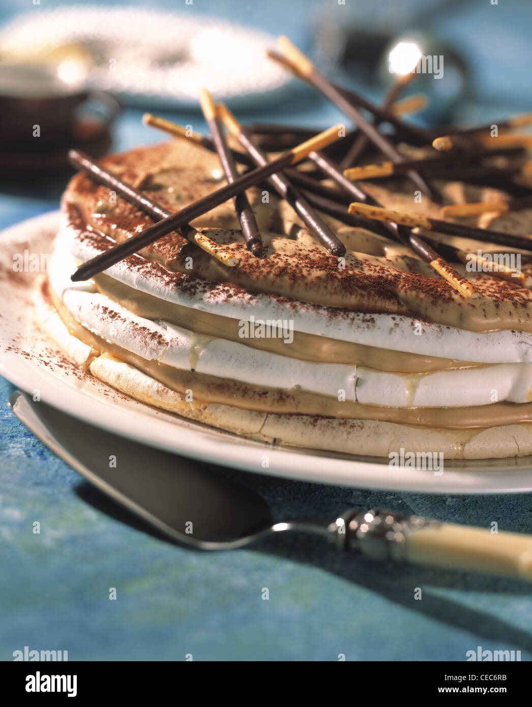 Mocca meringue layered cake with chocolate sticks Stock Photo - Alamy