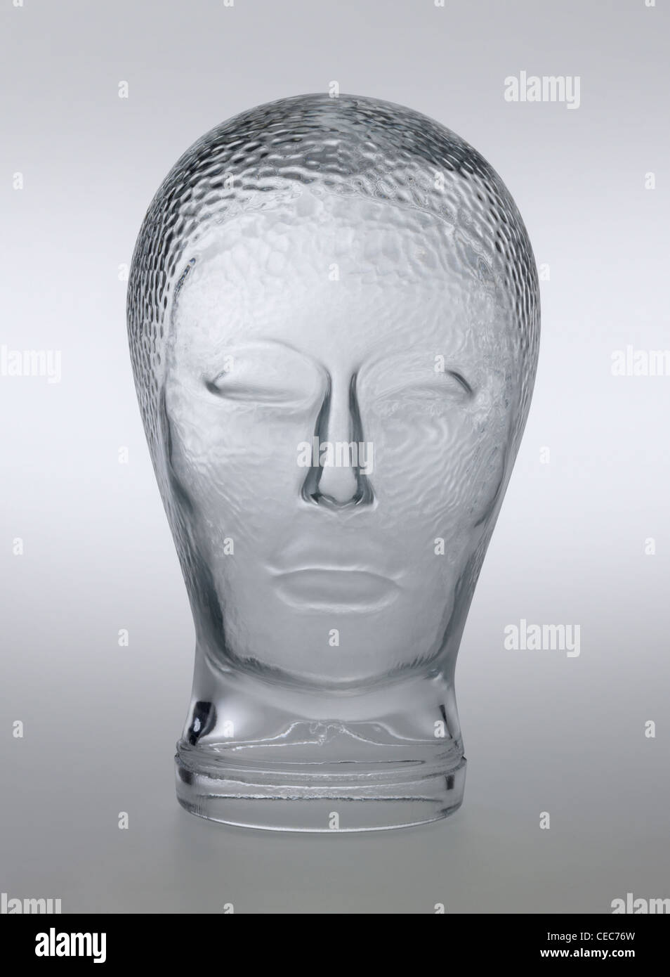 profile shot of a generic human "dummy" head made of glass in gradient ...