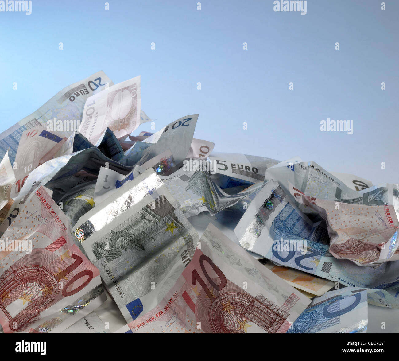 lots of crumbled euro bank notes in blue back Stock Photo - Alamy