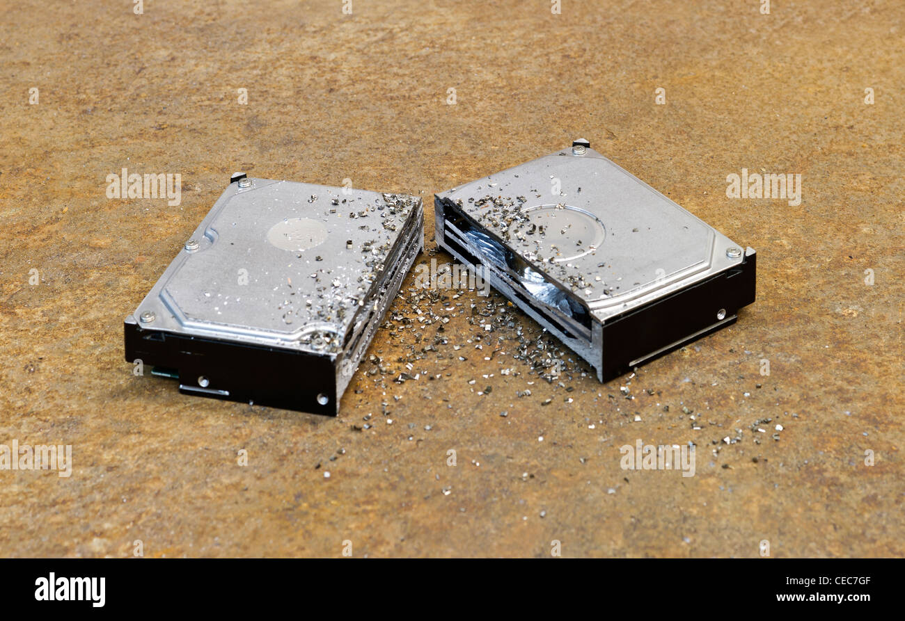 halved hard disk drive in rusty back Stock Photo - Alamy