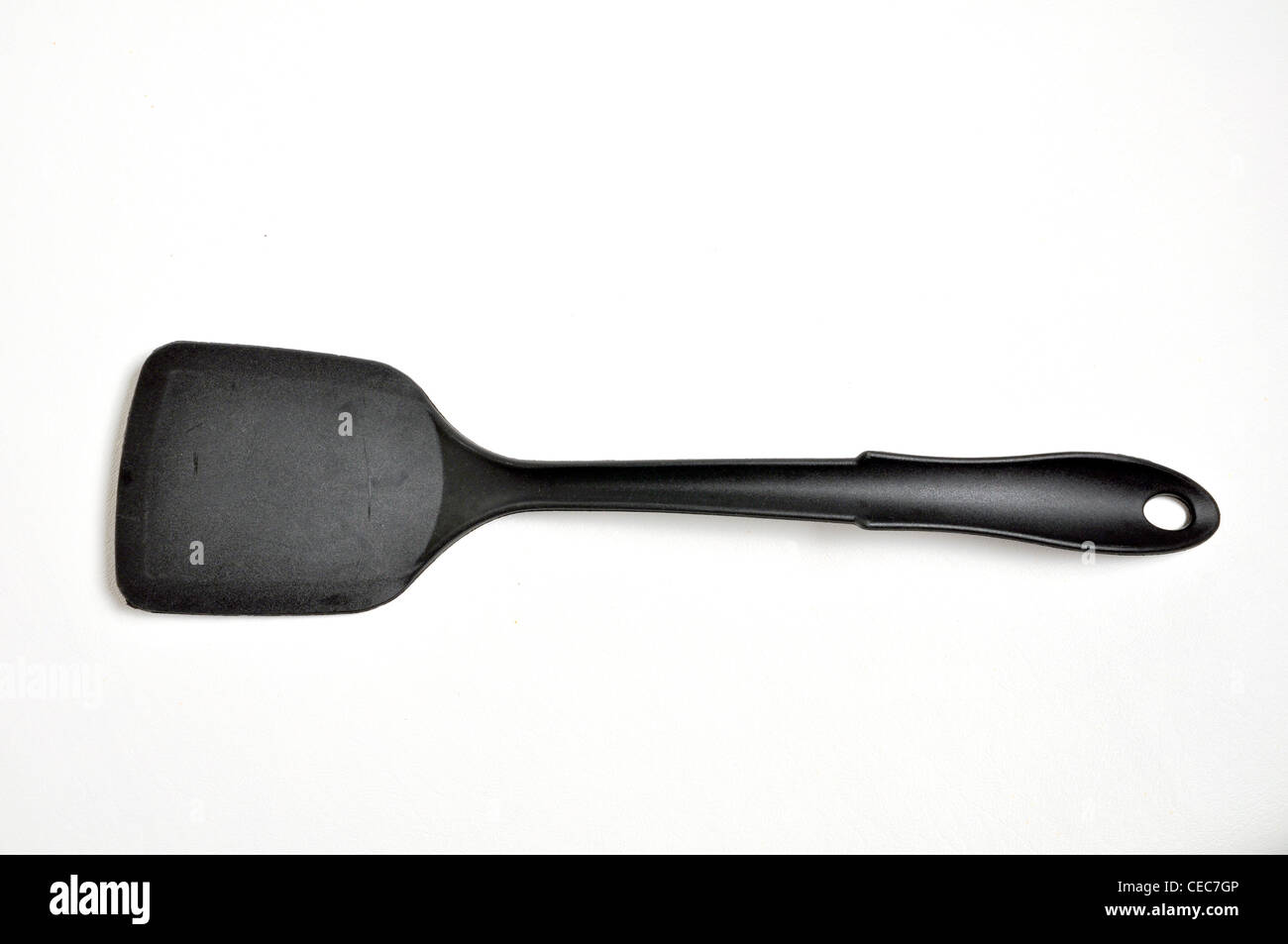 A spatula is laying on a white background Stock Photo - Alamy