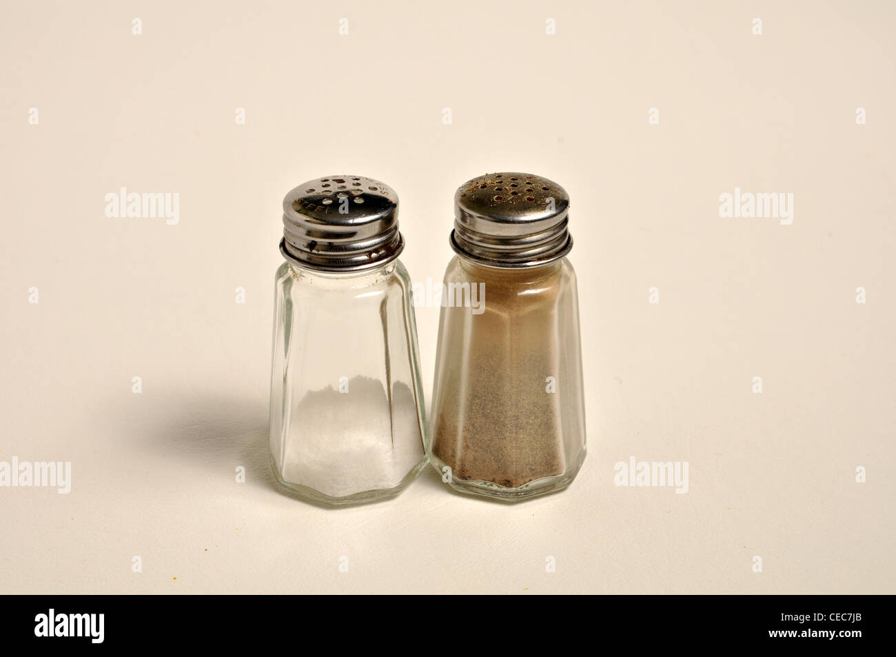 A salt and pepper shaker side beside each other Stock Photo - Alamy