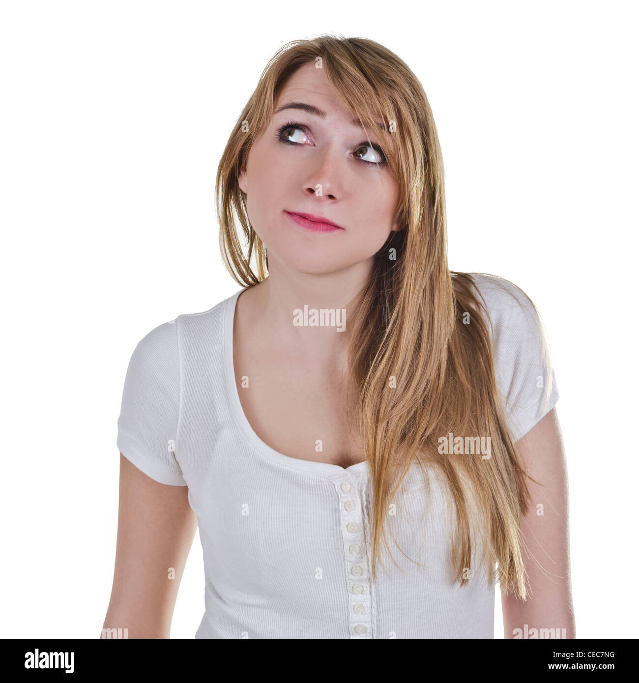 Young woman looking up-right with expression as she is satisfied about ...