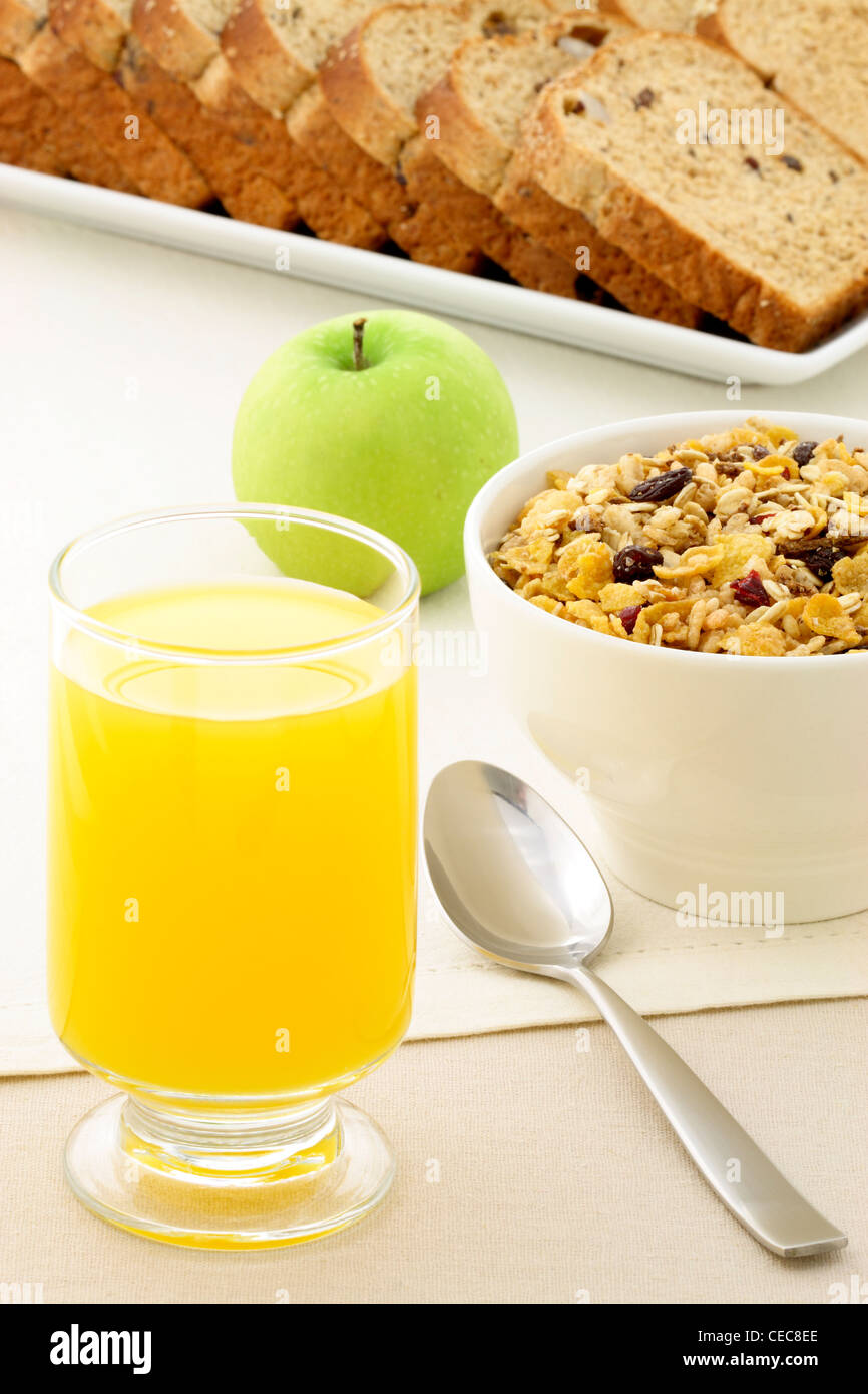 delicious breakfast with orange juice, whole grain bread,fresh apple ...