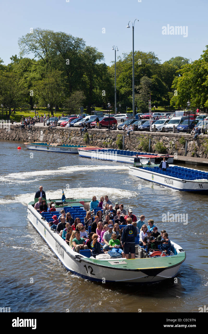 Tourists who travel on sightseeing canal boat Paddan in Gothenburg ...