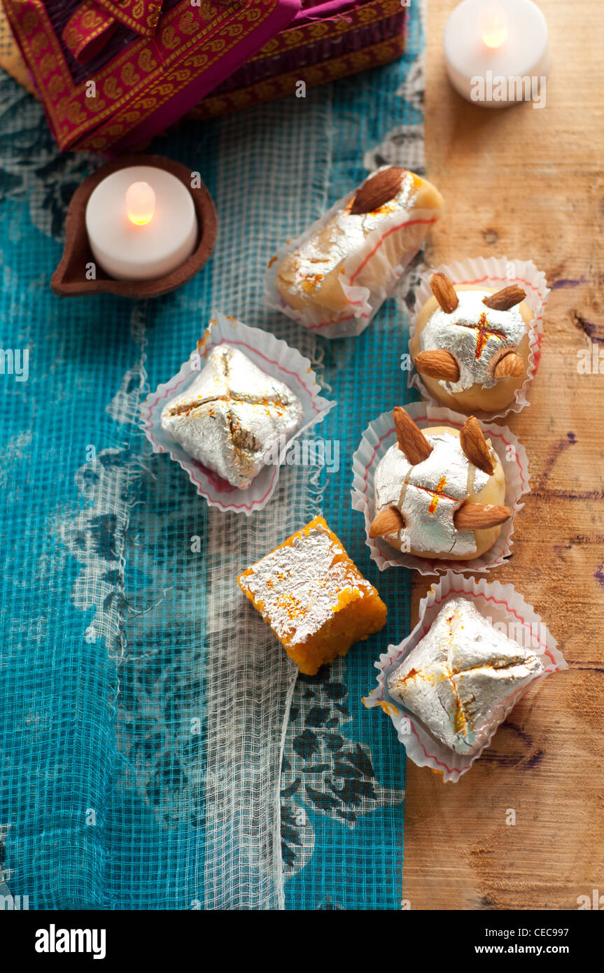 Diwali sweets on rustic indian background Stock Photo - Alamy