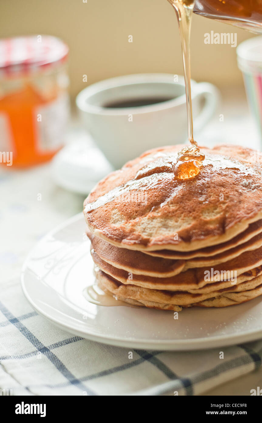 Pancake with honey pour Stock Photo - Alamy