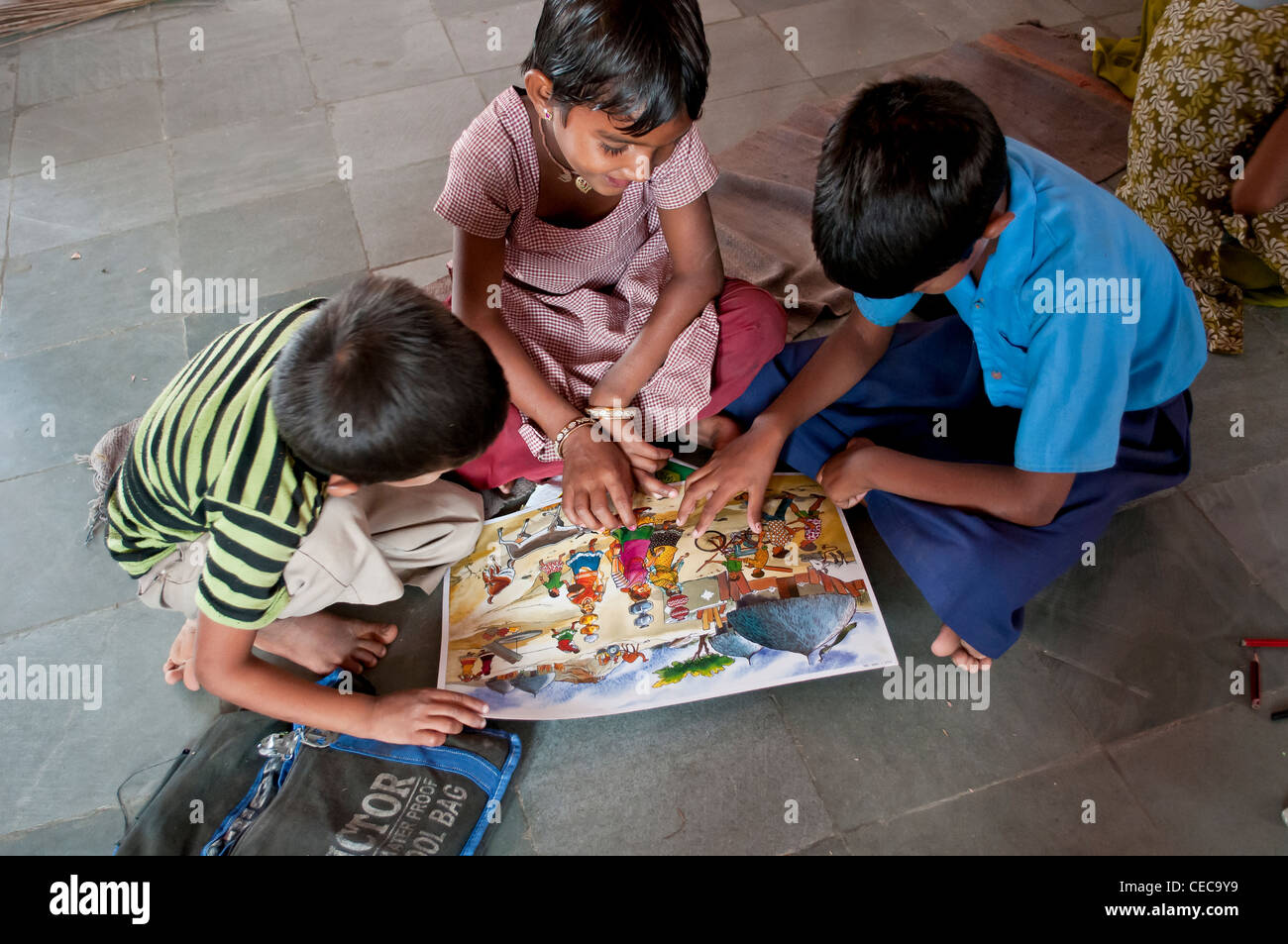 Children in class telling a story from a picture, Village school near ...