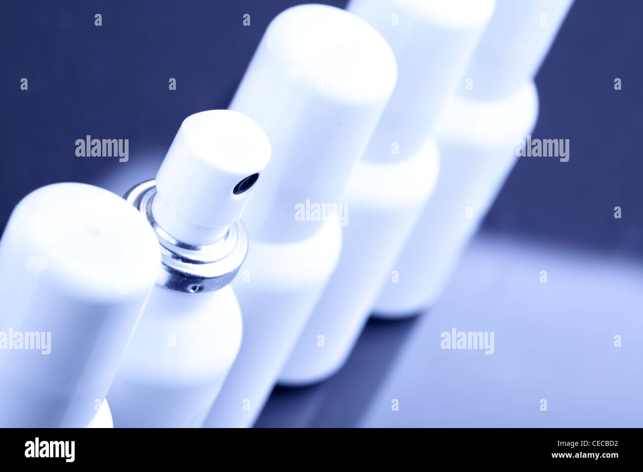 Spray cans with medication in a row Stock Photo - Alamy
