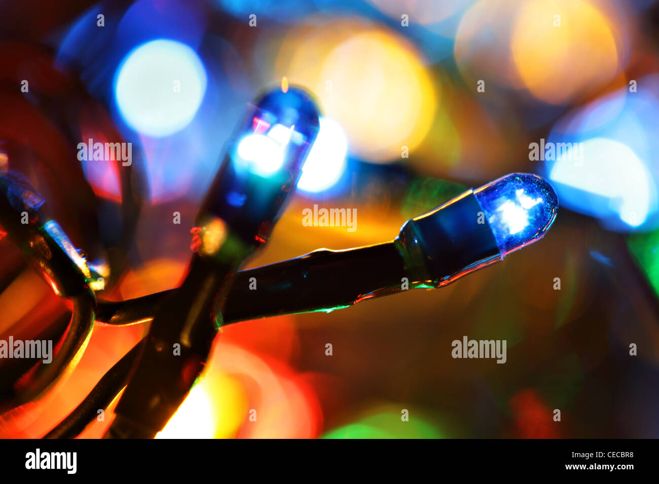 Colorful electric light bulbs and lights out of focus Stock Photo - Alamy
