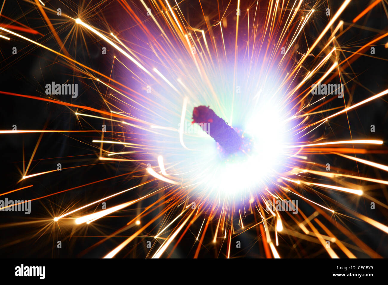 Sparkler on fire close-up over black background Stock Photo - Alamy