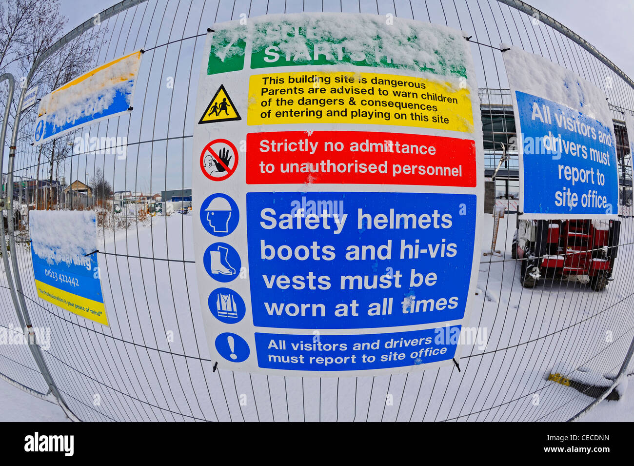 Building or construction warning and safety sign fixed to a metal wire ...