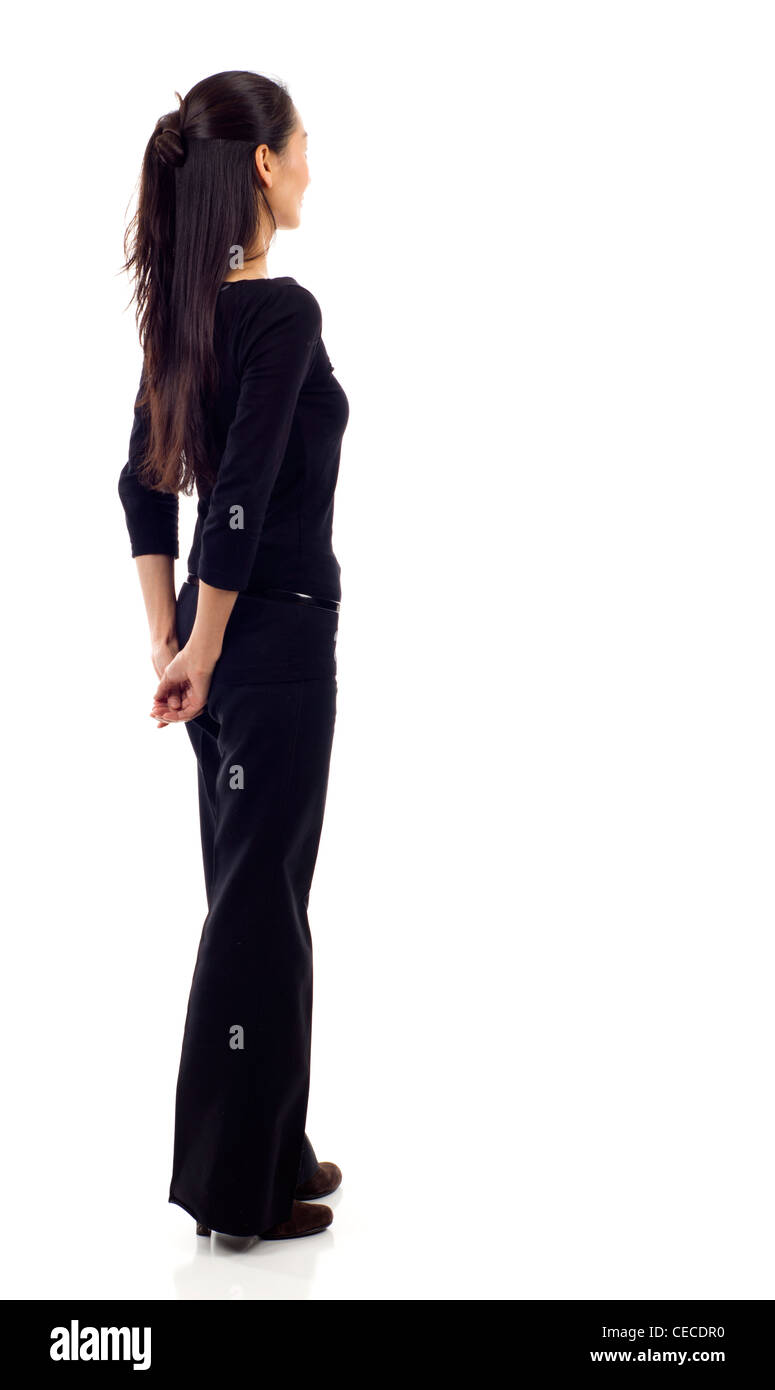 Asian business woman from the back - looking at something isolated over ...