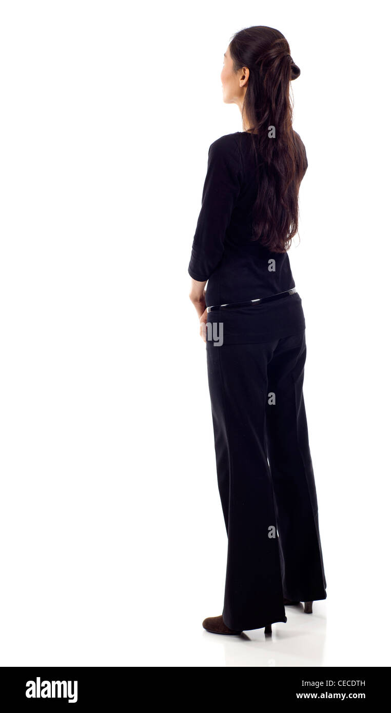 Asian business woman from the back - looking at something isolated over ...