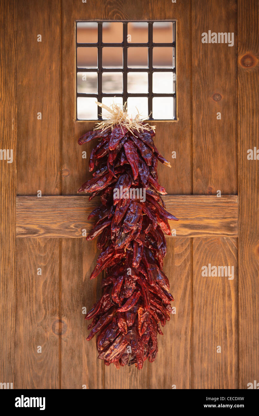 Santa Fe, New Mexico, United States. Traditional chile ristra hangs ...