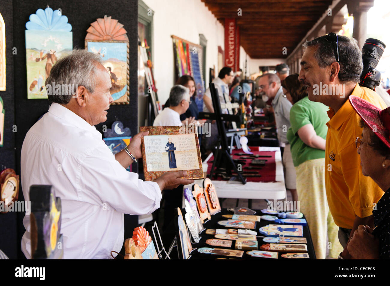 Santa Fe, New Mexico, United States. Spanish Market. Man selling ...