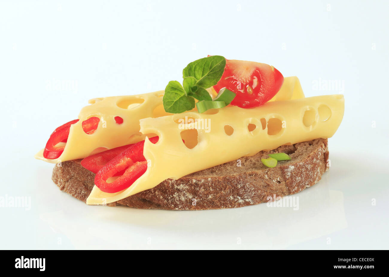 Slice of brown bread and Swiss cheese Stock Photo - Alamy