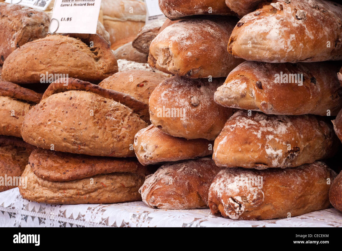 Loaves of fresh bread stacked at a Market Stock Photo - Alamy