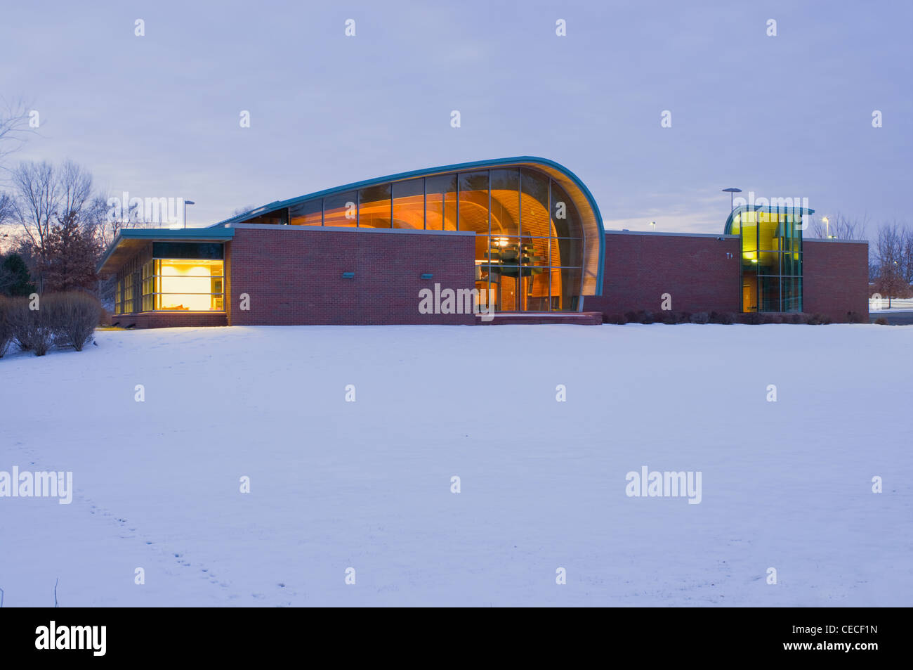 Inver Glen Public Library exterior at sunrise with interior illuminated ...