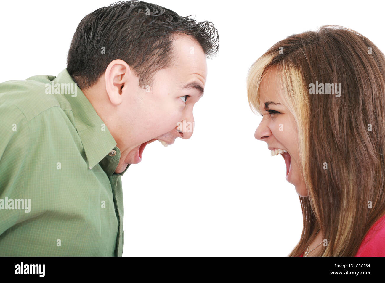 Portrait of a man and woman yelling at each other against white ...