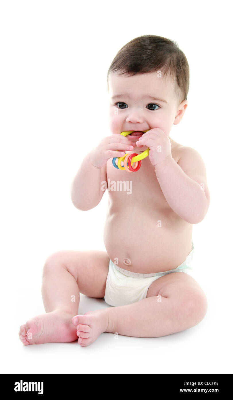 Baby biting on rattle Stock Photo - Alamy