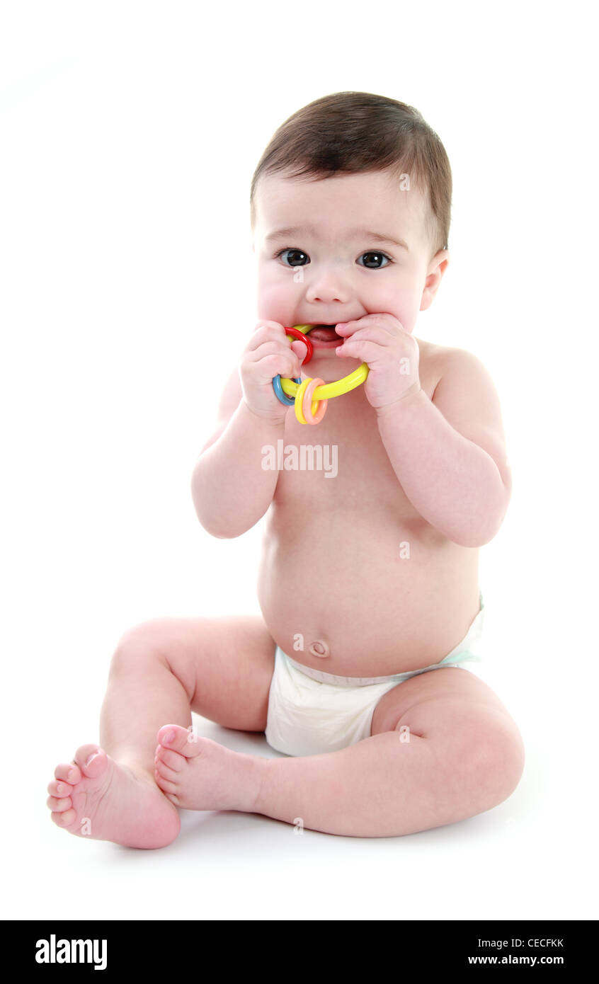 Baby biting on teether Stock Photo - Alamy