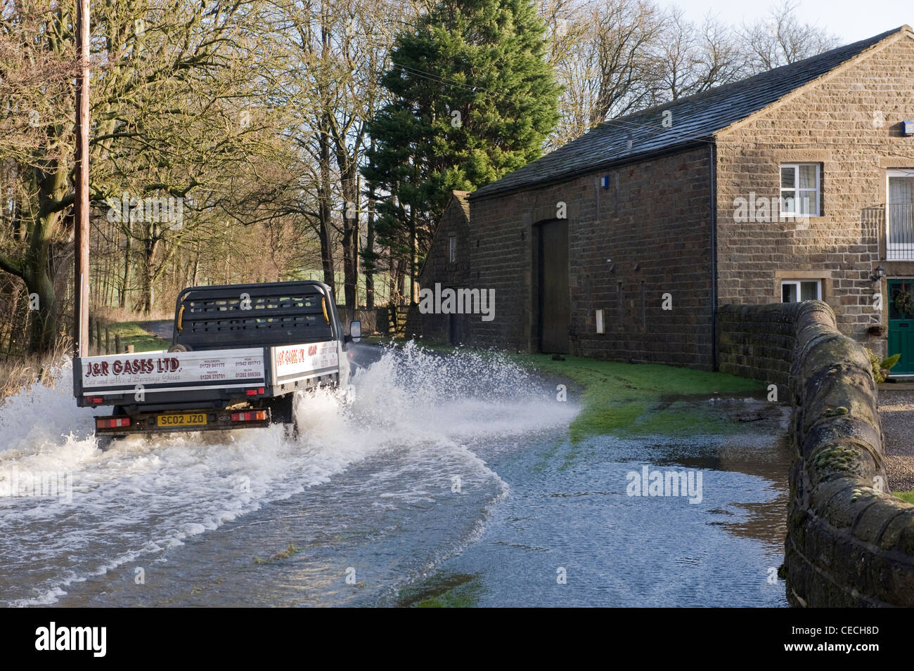 Flooding - vehicle (truck) driving & splashing through deep flood water ...