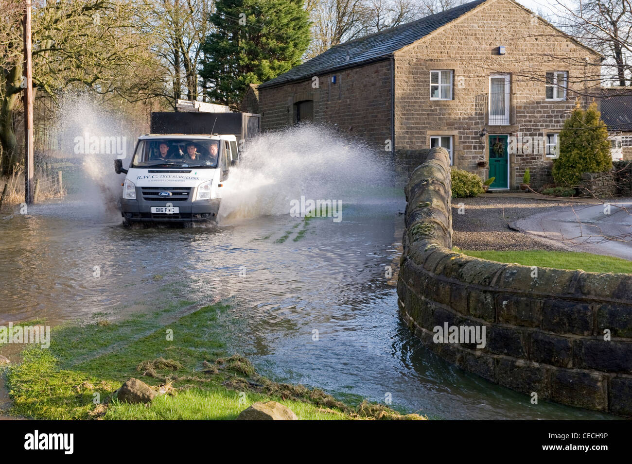 Flooding - truck (men in cab) driving & splashing through deep flood ...