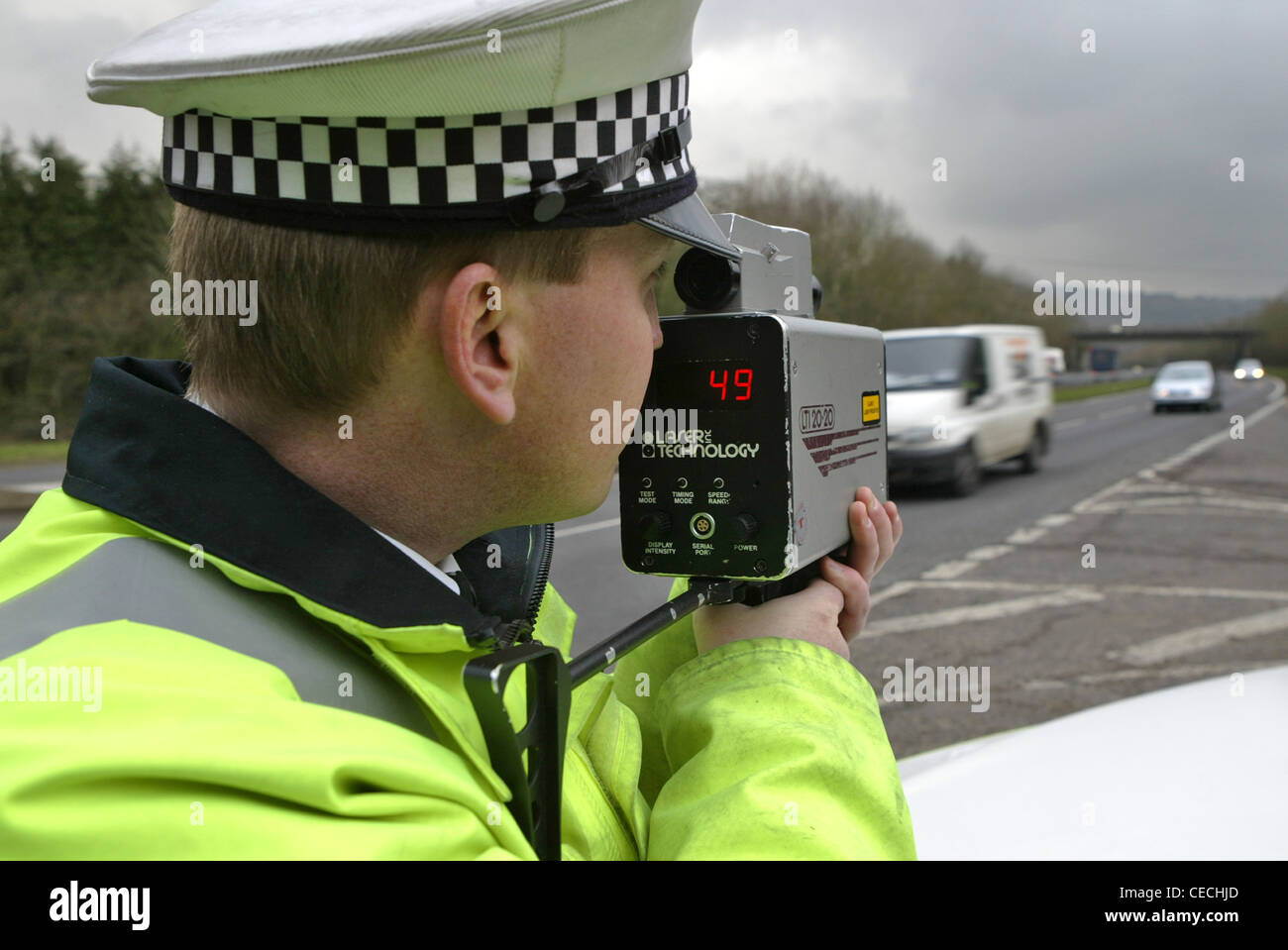Traffic police officer using speed trap laser gun, United Kingdom Stock ...