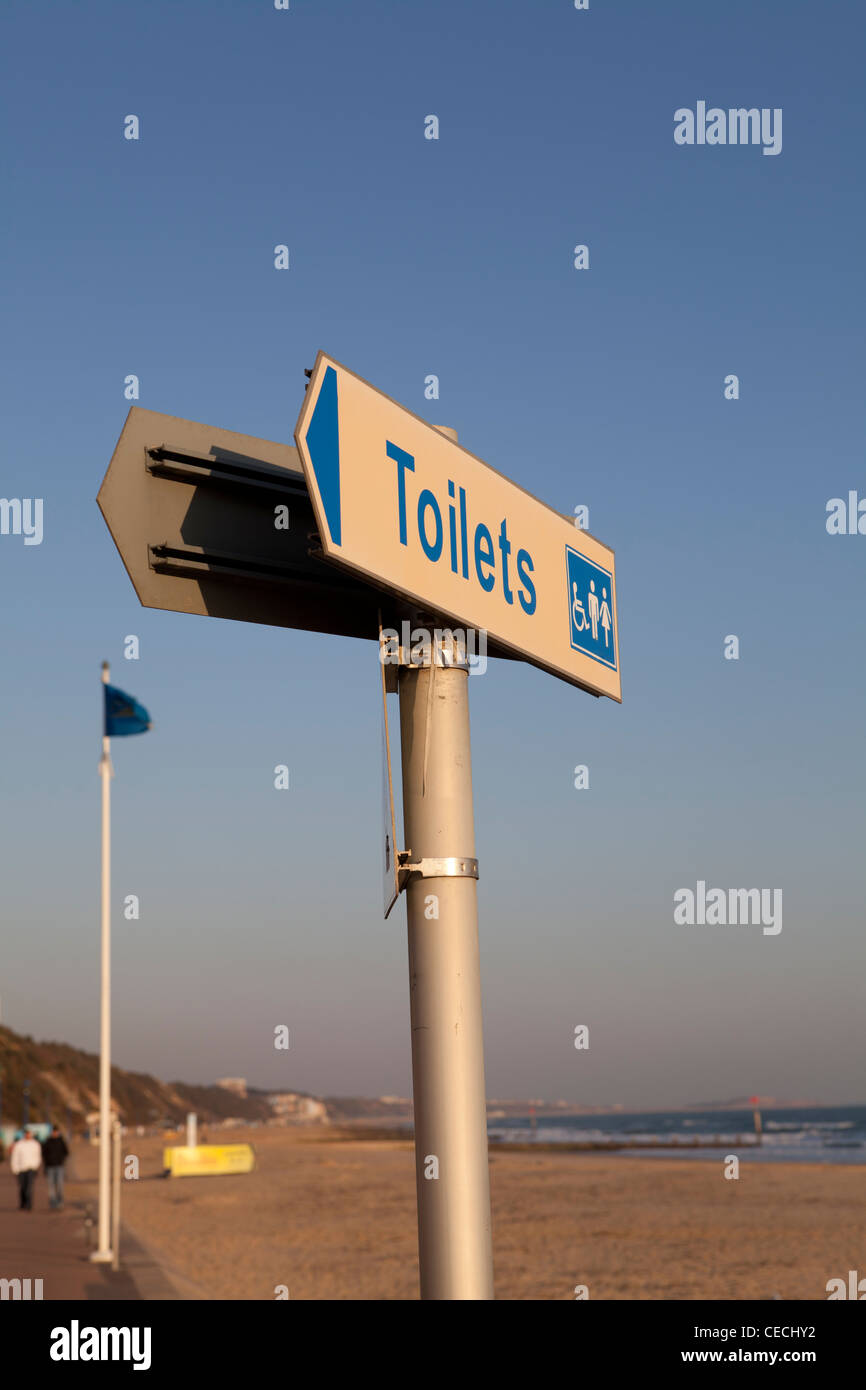 A sign directing people to public toilets Stock Photo - Alamy