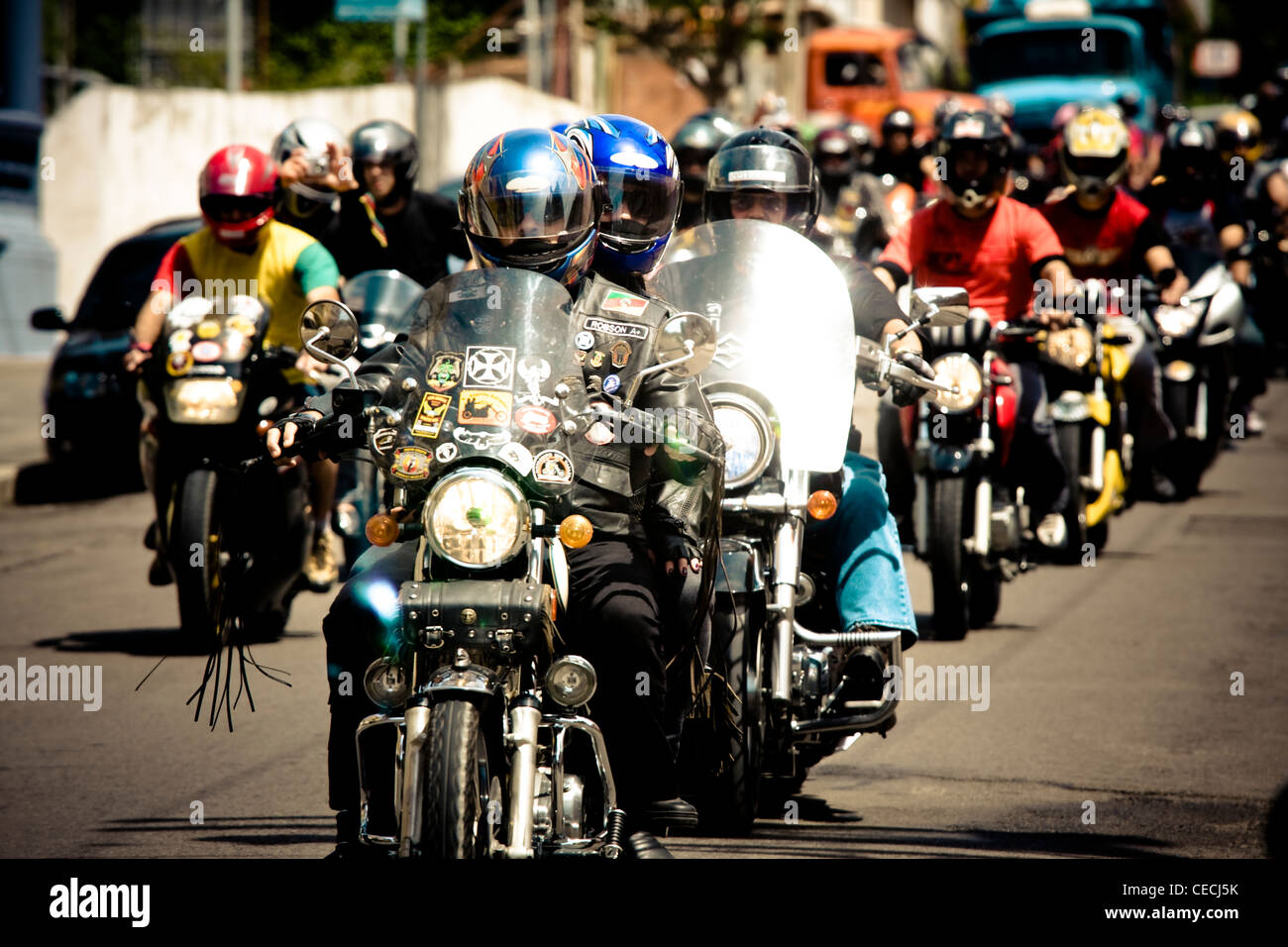 motorcycles on street in a row as a parade part of Mercocycle, an event ...