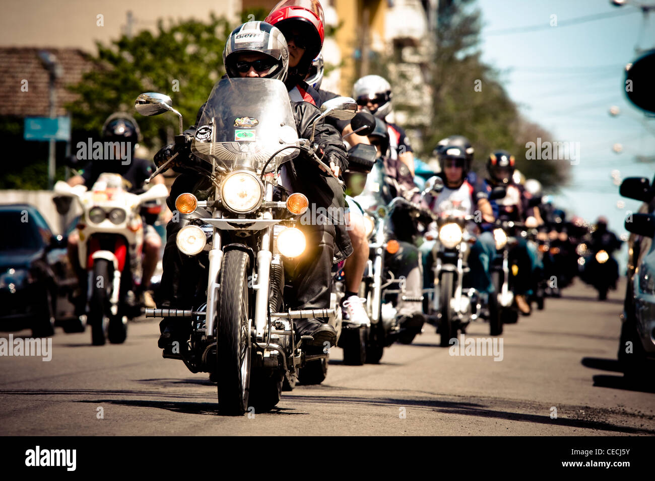motorcycles on street in a row as a parade part of Mercocycle, an event ...
