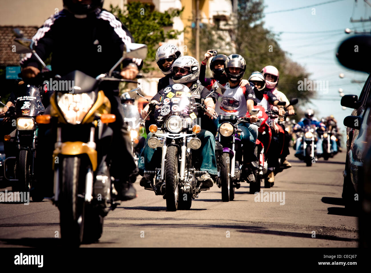motorcycles on street in a row as a parade part of Mercocycle, an event ...