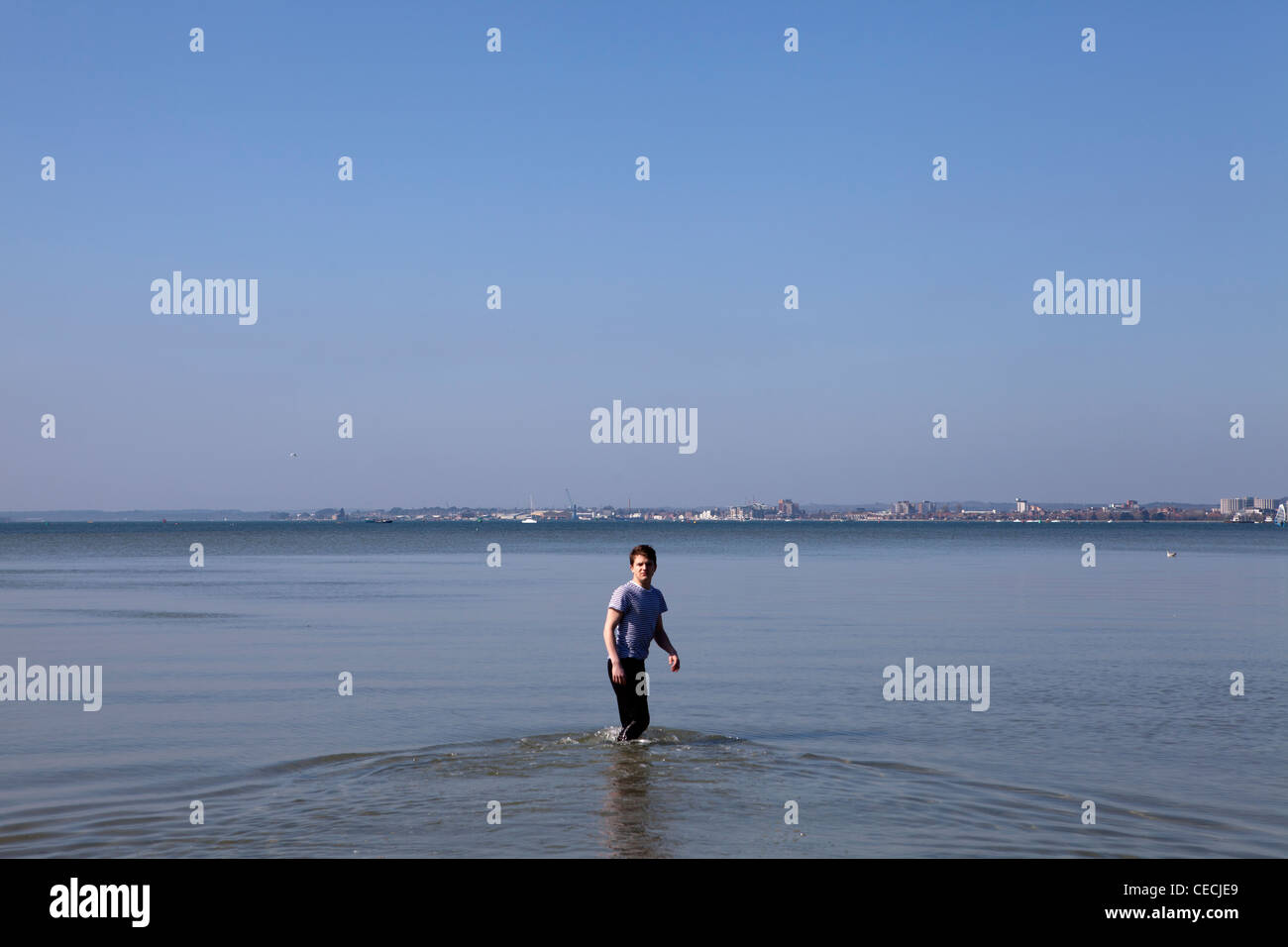 Man standing in sea Stock Photo - Alamy