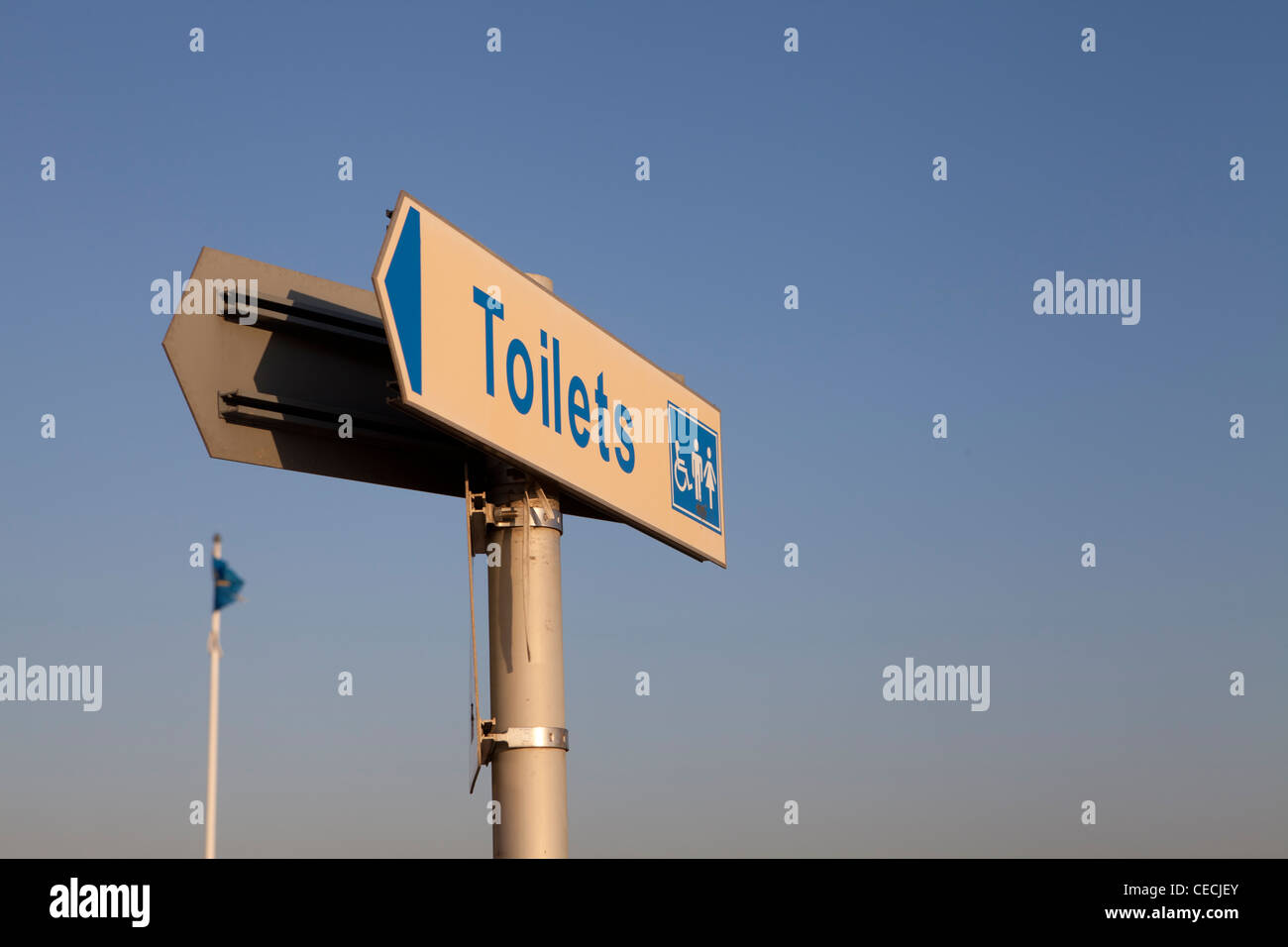 A sign directing people to public toilets Stock Photo - Alamy