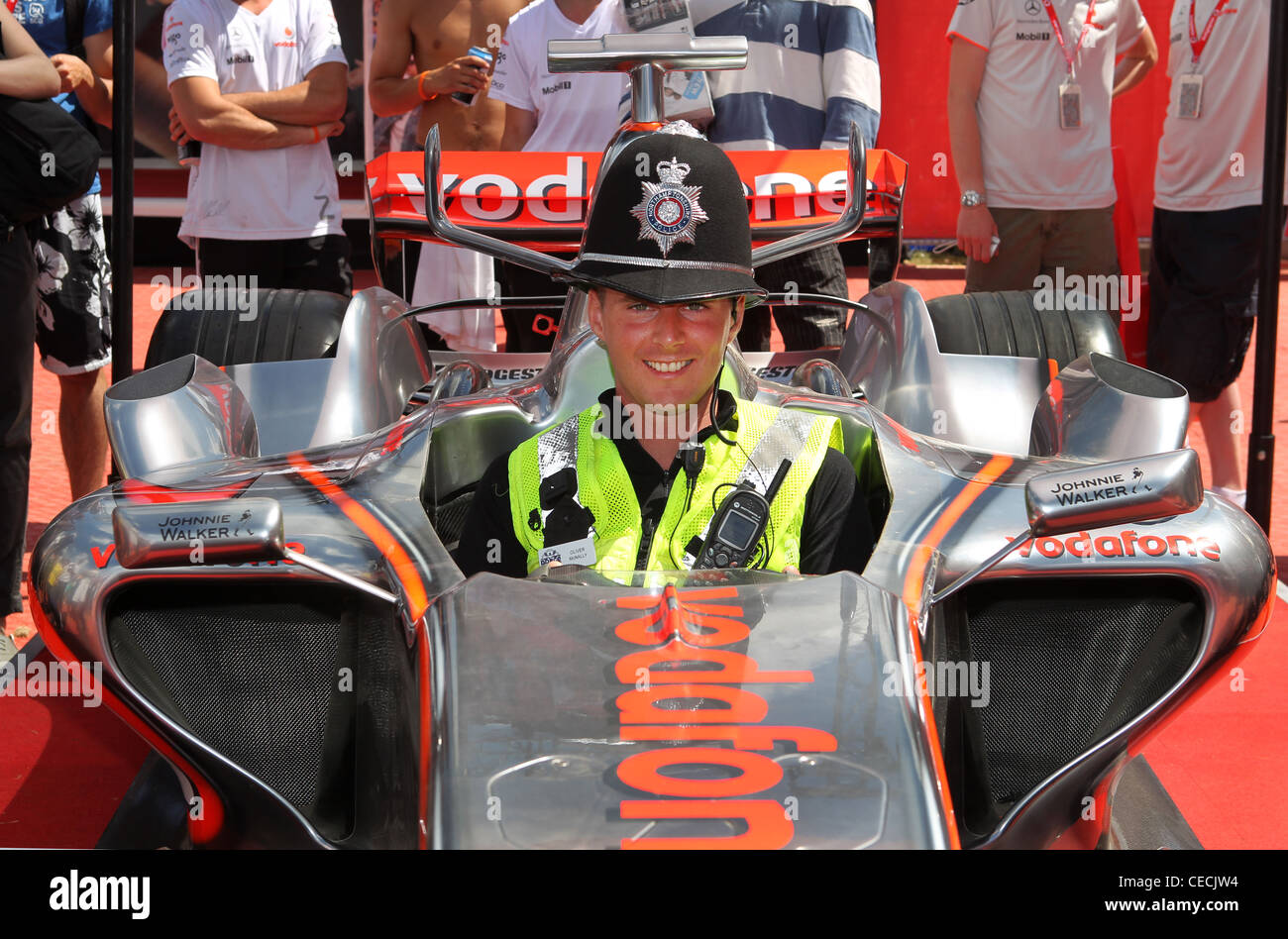 British Policeman sitting in a MacClaren Mercedes Formula One Grand ...