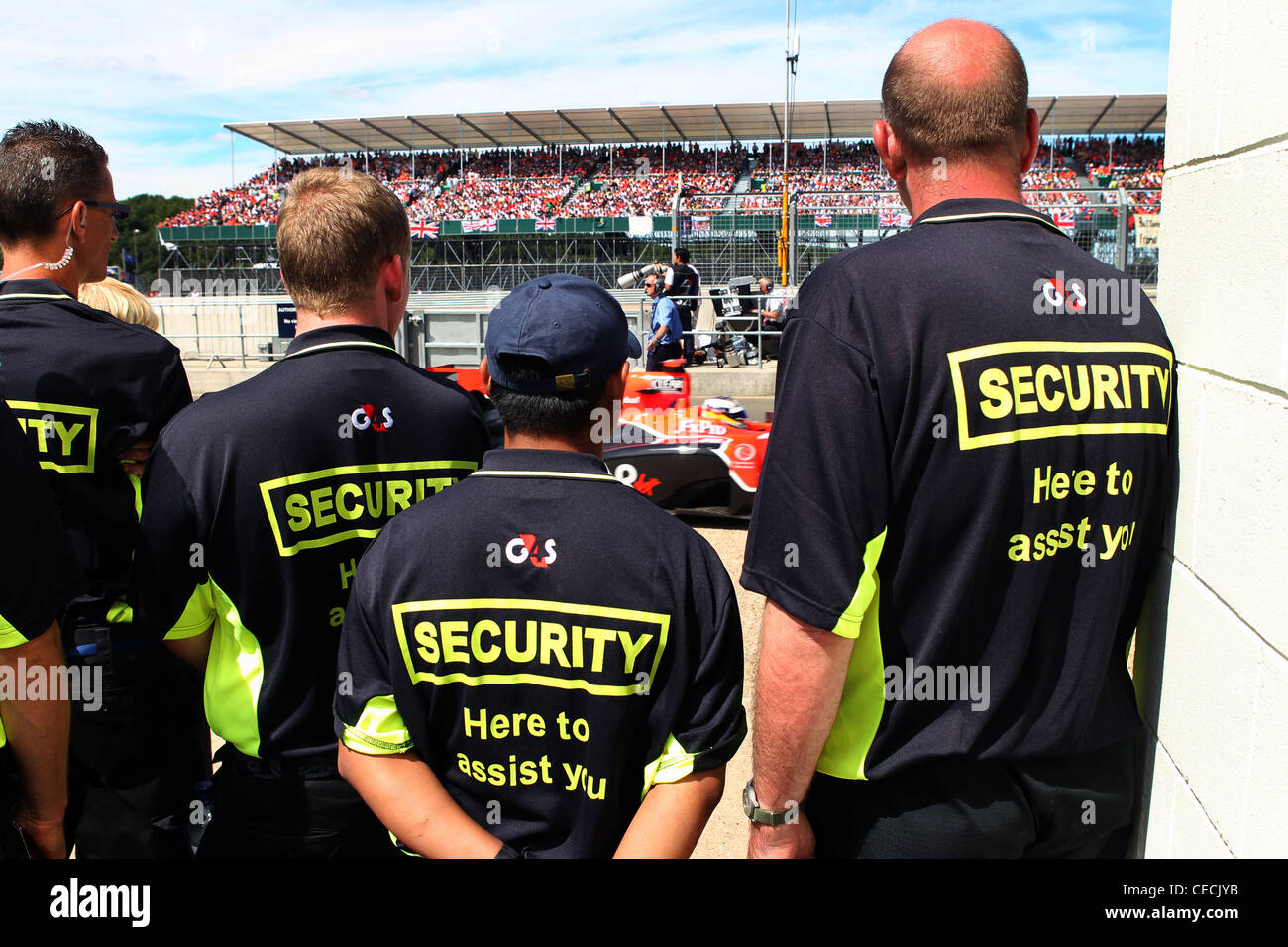Security guards by the entrance to the pit lane at the 2010 British ...