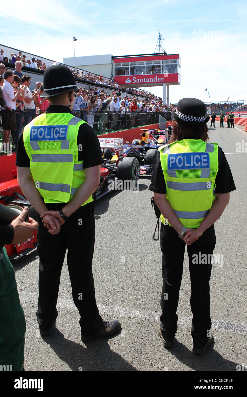 British Police guard the entrance to parc ferme at the Formula One ...