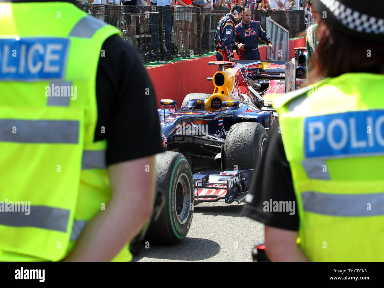 British Police guard the entrance to parc ferme at the Formula One ...