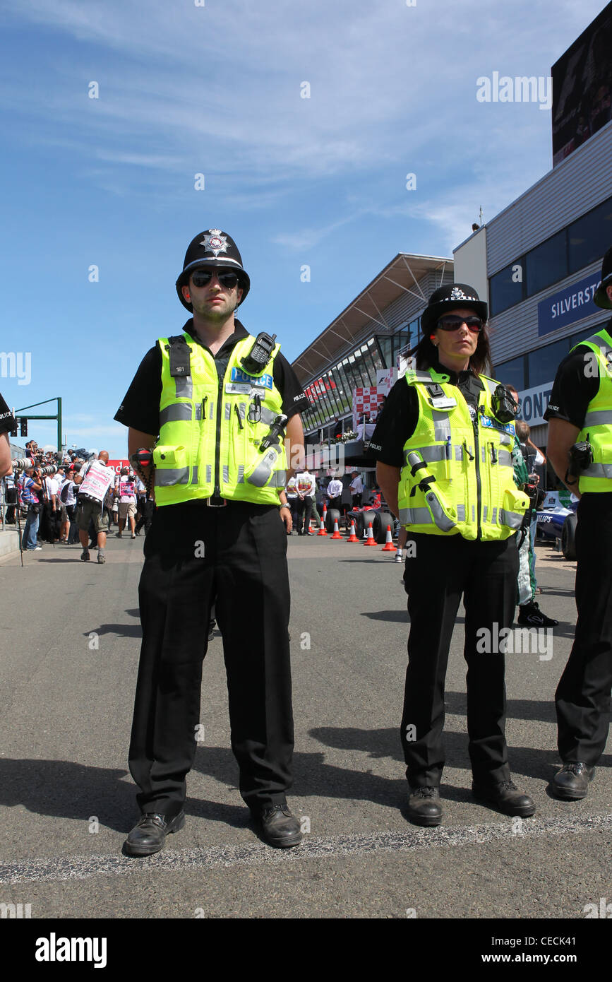British Police guard the entrance to parc ferme at the Formula One ...