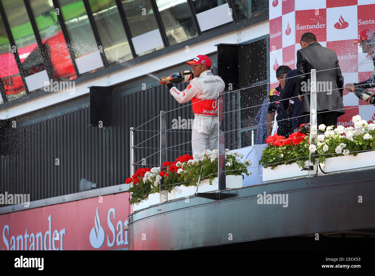 Lewis Hamilton celebrating on the podium at the 2010 British Formula ...