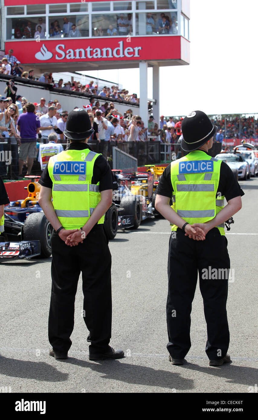 British Police guard the entrance to parc ferme at the Formula One ...