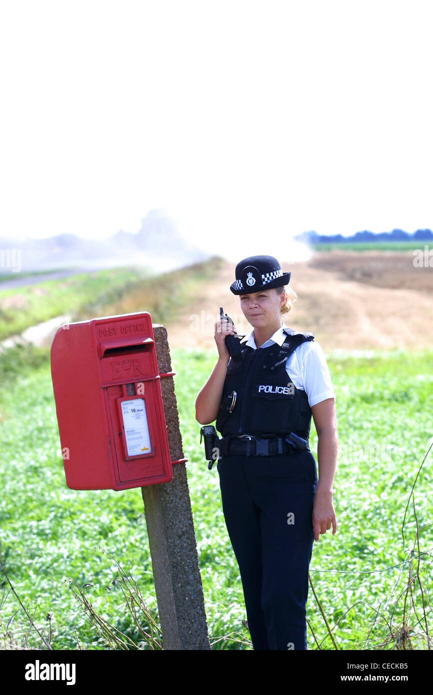 British Police officer patrolling rural area of Suffolk Stock Photo - Alamy