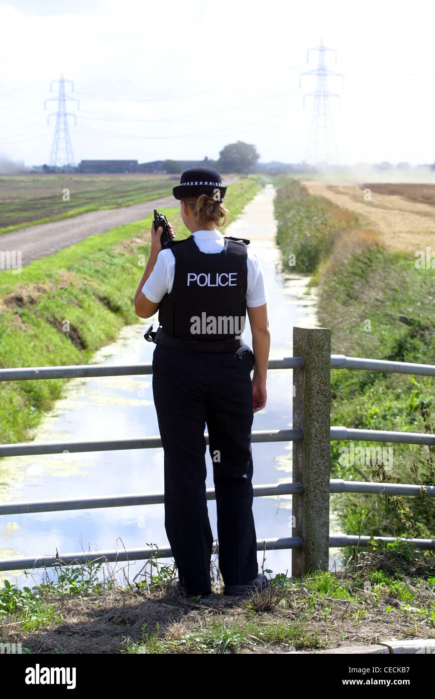 British Police officer patrolling rural area of Suffolk Stock Photo - Alamy