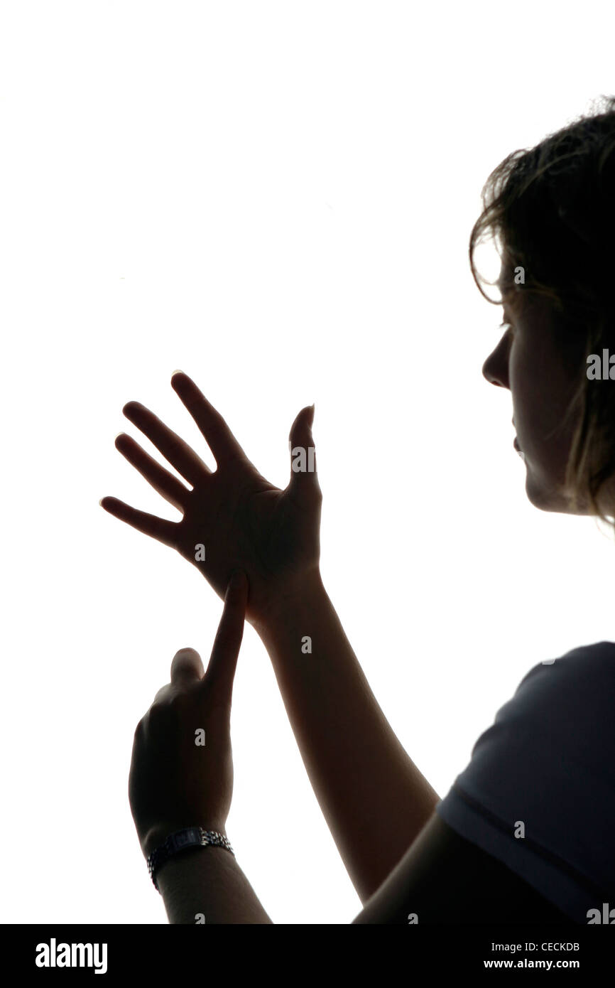 Woman using sign language Stock Photo - Alamy
